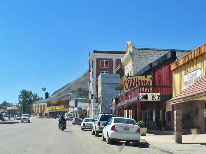 Main Street Tonopah, where the Wild West meets small-town charm and that mountain backdrop looks like it was painted by Bob Ross on an especially inspired day.