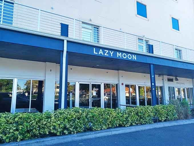 The iconic blue signage stands out against the building's neutral tones, like a beacon for hungry travelers seeking pizza salvation.