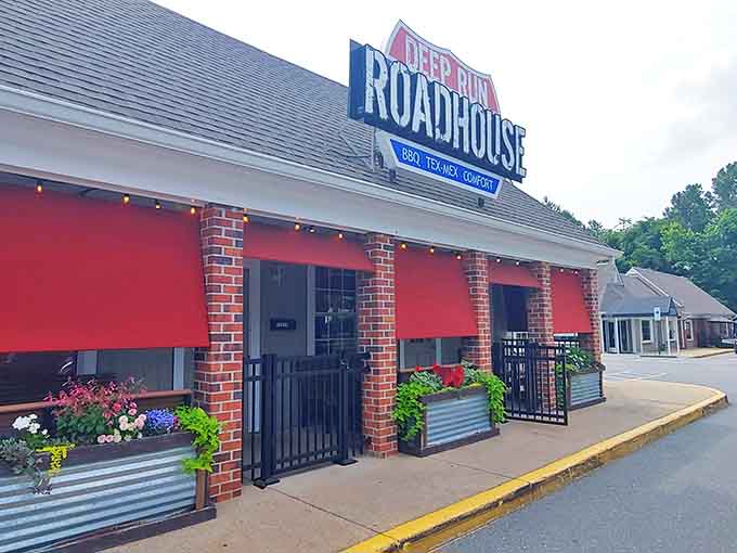The welcoming storefront of Deep Run Roadhouse proudly announces its triple threat of BBQ, Tex-Mex, and comfort food delights.
