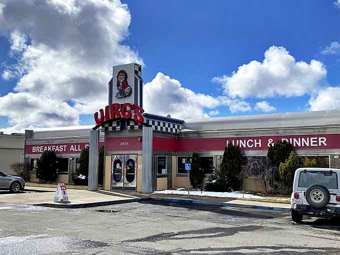 The classic '50s diner silhouette of Virg's stands proudly against Utah's blue sky, its red neon sign a beacon for hungry travelers seeking comfort food salvation.