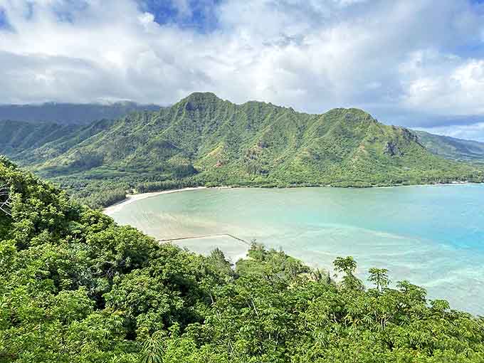Mother Nature showing off her best angles where emerald mountains embrace turquoise waters. Hawaii's version of a perfect sandwich&mdash;land, sea, and sky layered to perfection.