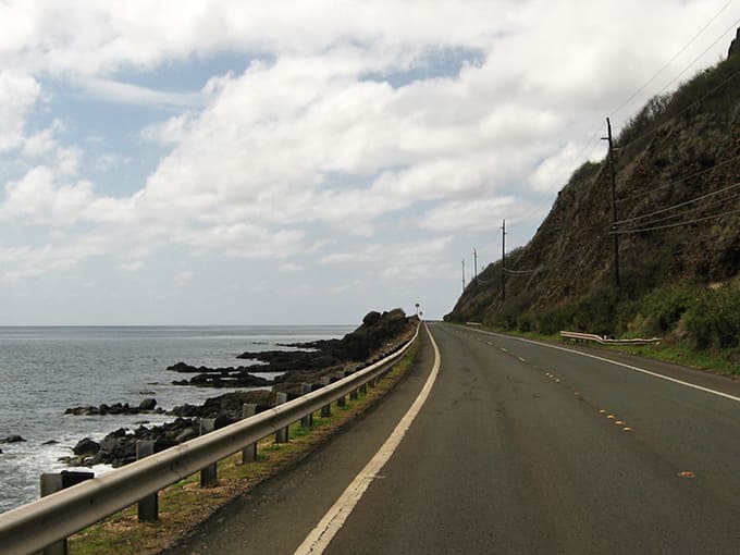 Where asphalt meets ocean&mdash;Kamehameha Highway hugs the coastline like an old friend, offering therapeutic views with every curve of the road.