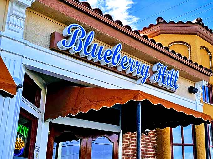 The iconic Blueberry Hill signage promises comfort food salvation, standing out against the warm stucco like a delicious mirage for weary travelers.
