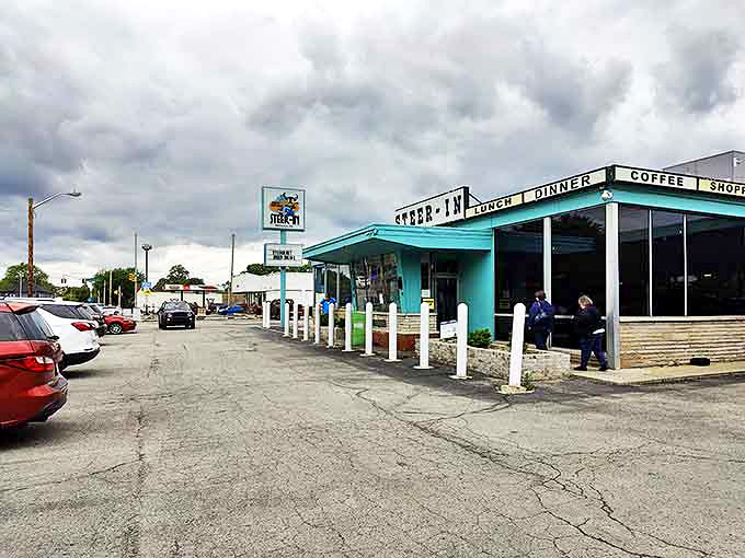 Under moody Indiana skies, the Steer-In's "LUNCH DINNER COFFEE SHOP" signage promises comfort food salvation to east side locals and visitors alike.