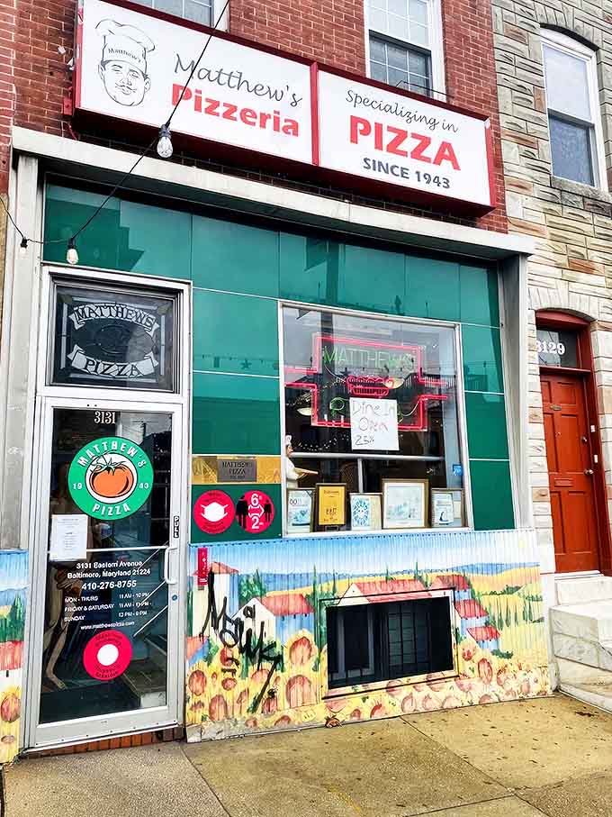 The emerald-tiled facade of Matthew's Pizzeria stands as a beacon of pizza perfection on Eastern Avenue, promising delicious traditions since 1943.