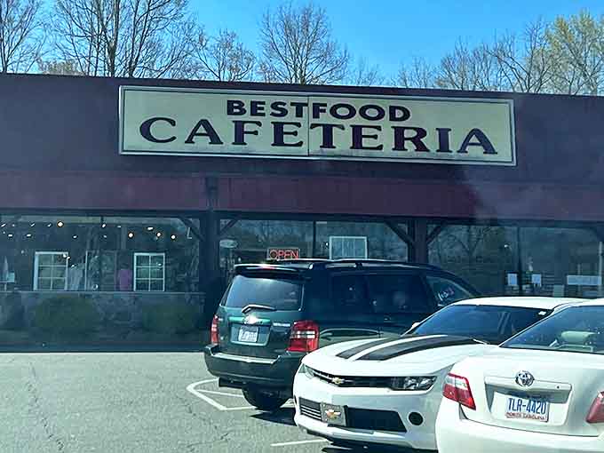 That glowing "OPEN" sign might as well say "PARADISE" for hungry travelers seeking authentic Southern cooking without pretense. The parking lot's full for good reason.