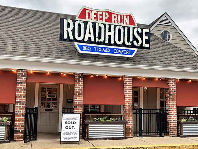 The welcoming storefront of Deep Run Roadhouse proudly announces its triple threat of BBQ, Tex-Mex, and comfort food delights.