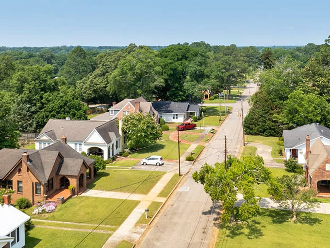 Tree-lined streets and well-kept lawns tell the story of Troy, where neighbors still wave and front porches aren't just for show.