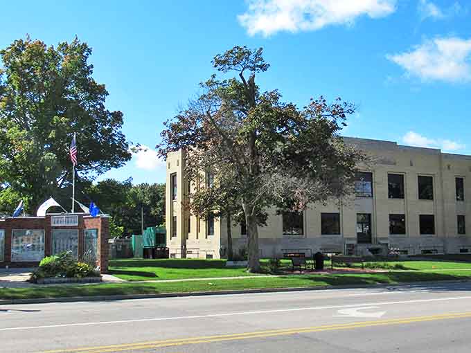 Historic Gladwin County courthouse stands proudly under Michigan's blue skies, a cornerstone of small-town civic life.