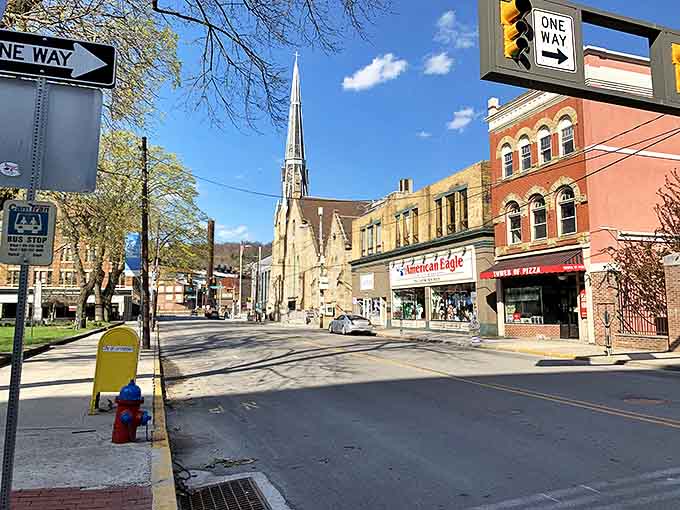 Classic storefronts and a rising church spire define this Johnstown streetscape. A place where everyday life moves at a comfortable pace.