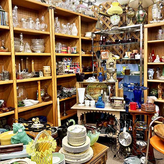 Glassware paradise! Crystal, china, and collectibles fill wooden shelves in this meticulously arranged vendor space&mdash;each piece waiting to tell its story.