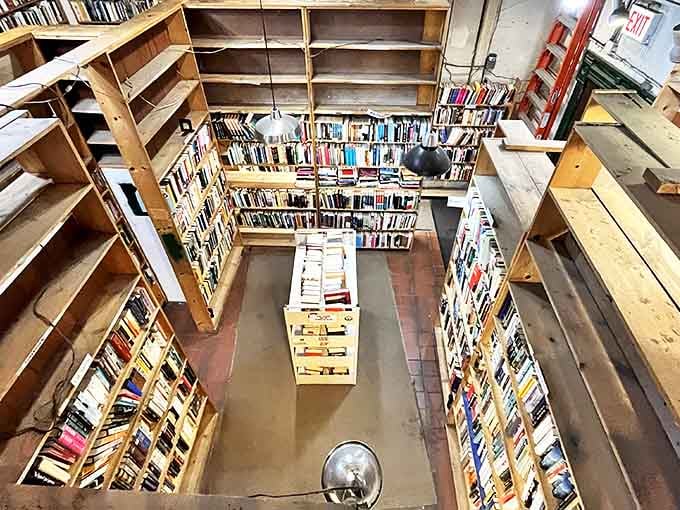 Wooden shelves stretch toward infinity in Myopic's basement level, where hidden literary treasures await curious explorers in every aisle.