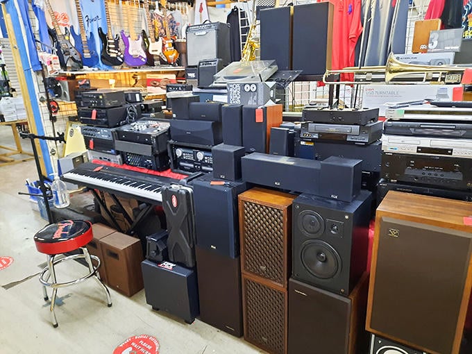 Vintage stereo equipment, speakers, and musical instruments create an audiophile's paradise where yesterday's technology awaits new appreciation.