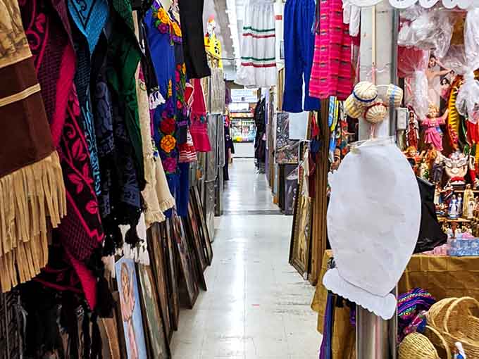 Narrow pathways of possibility – where vibrant textiles from around the world transform ordinary shopping trips into international treasure hunts without the passport fees.