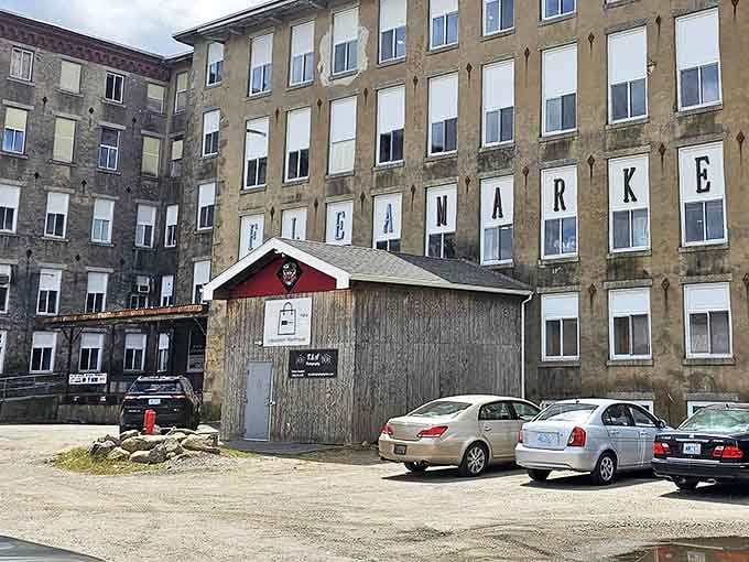 The imposing stone facade of The Old Mill stands as a monument to Rhode Island's industrial past, now housing treasures waiting to be discovered.