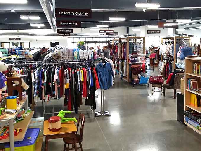 The well-organized interior of UGM Thrift Store showcases clear signage and neatly arranged departments, making treasure hunting a breeze rather than a marathon.
