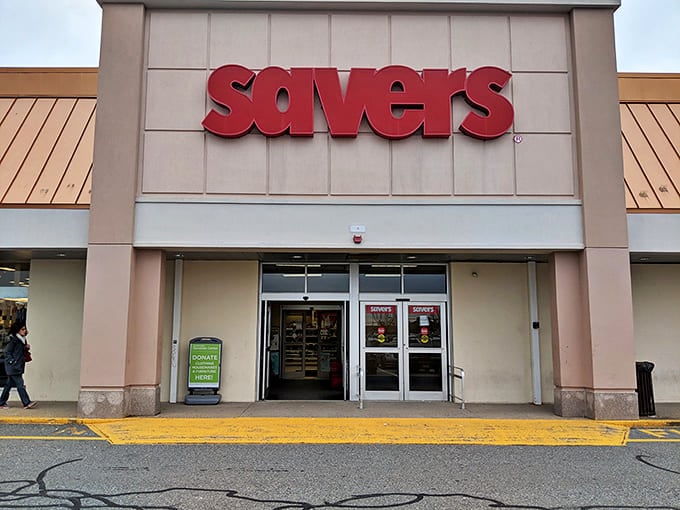 The iconic red Savers sign beckons like a lighthouse for bargain hunters, promising treasures inside that won't require a second mortgage to take home.