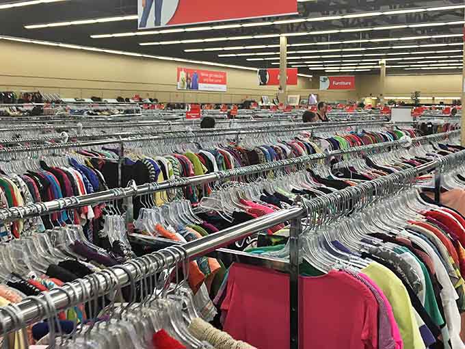 A sea of clothing stretches as far as the eye can see, each hanger holding someone's past fashion choice waiting for its second act on a new stage.