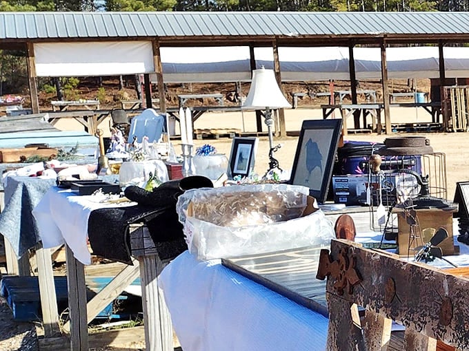 Vintage lamps, picture frames, and household treasures create an eclectic display under the covered market area for all-weather shopping.