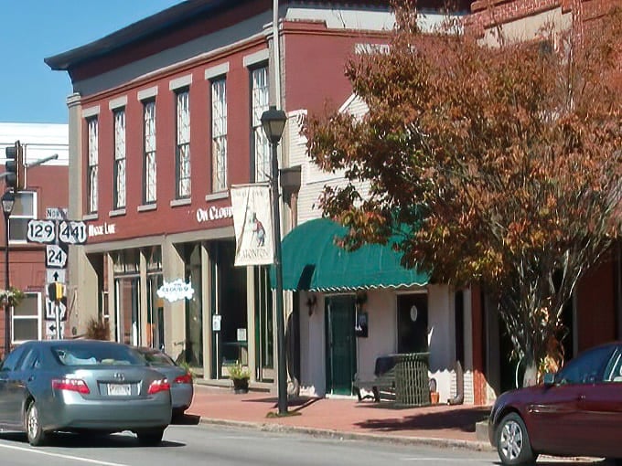 Downtown Eatonton's historic storefronts transport you to a simpler time, where brick facades and green awnings create the perfect small-town tableau.