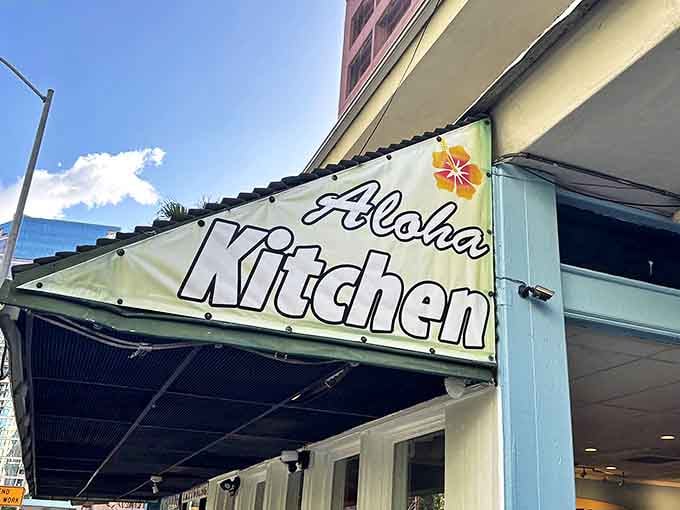 Aloha Kitchen's iconic green awning welcomes hungry patrons to this beloved Honolulu breakfast spot on a perfect Hawaiian day.