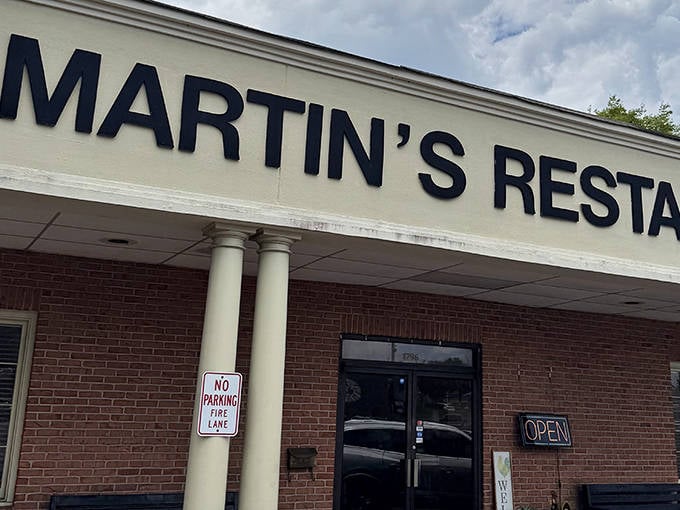 Those classic white columns aren't just architectural features&mdash;they're gateways to fried chicken nirvana. The "OPEN" sign might as well say "Heaven's Kitchen."