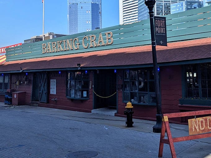Dusk settles over the Barking Crab as city lights begin to twinkle, transforming this humble seafood joint into Boston's most delicious waterfront beacon.