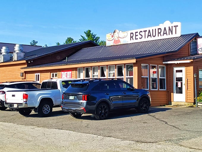 Morning sunshine bathes this unassuming culinary treasure, where locals' vehicles gather like faithful pilgrims at a temple of perfectly crisped hash and fluffy pancakes.