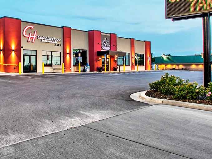 Twilight transforms Colonial House into a glowing sanctuary of home cooking, where the iconic "CH" logo welcomes hungry travelers like an old friend.