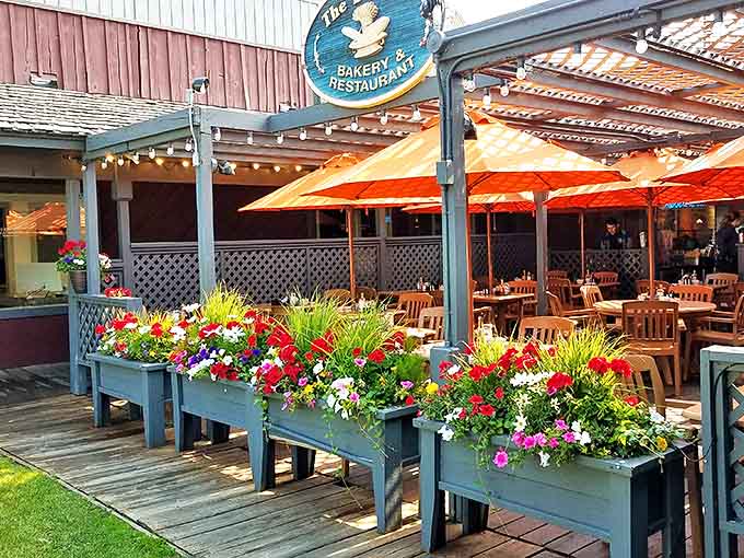 The Bunnery's outdoor seating area beckons with cheerful yellow umbrellas and planters bursting with seasonal blooms&mdash;a perfect spot to fuel up before Teton adventures.