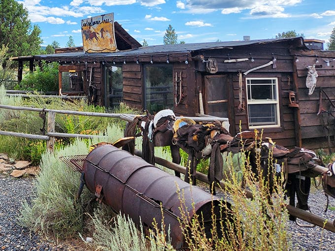 The Cowboy Dinner Tree stands defiant against time, its weathered exterior and authentic ranch equipment promising a genuine slice of Oregon's frontier spirit.