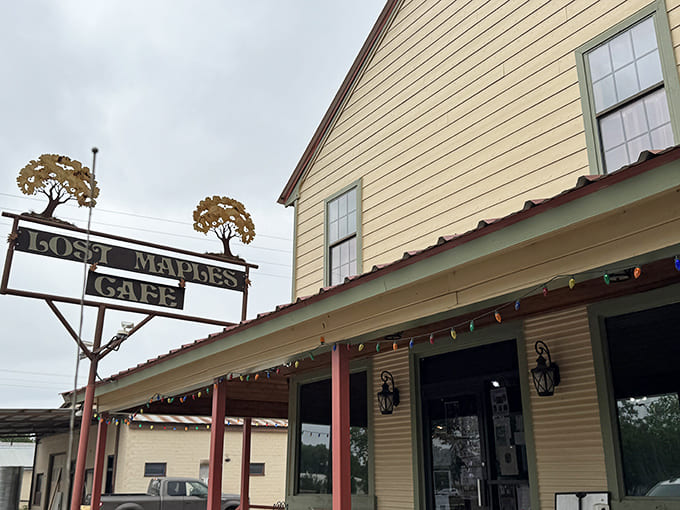 The weathered sign featuring maple trees stands proudly outside this unassuming building that houses legendary chicken fried steak.