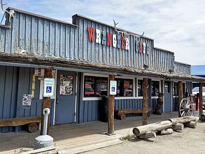 The Wrangler Cafe's weathered blue exterior isn't trying to impress anyone, which is exactly why it impresses everyone who visits this Pinedale institution.