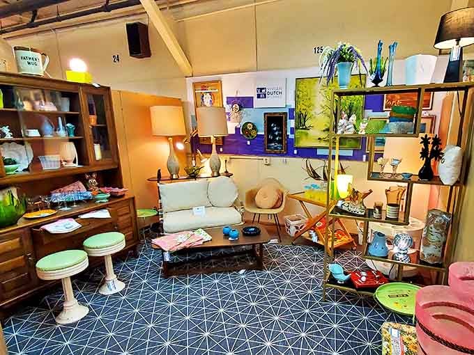 A mid-century modern display booth showcases pristine furniture, artwork, and decorative pieces that transport visitors to another era.