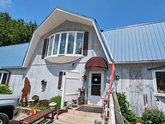 The charming barn-style architecture of Northwood Antique & Collectible Center houses three floors of vintage wonders beneath its blue roof.