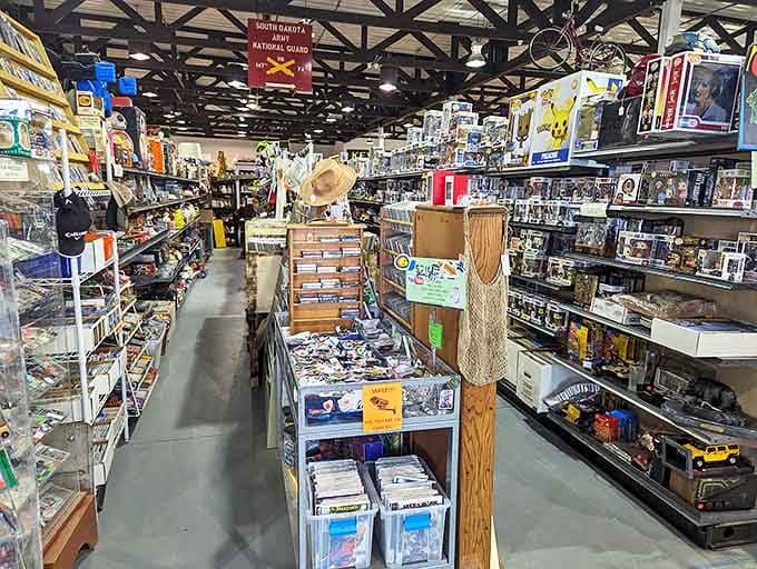 Down the rabbit hole of collectibles you go! Aisles stretch into infinity under exposed beams, promising discoveries that'll have you texting photos to your siblings saying "Remember these?"
