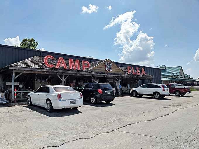 The unmistakable rustic facade of Camp Flea beckons treasure hunters with its bold red lettering and cabin-inspired entrance—adventure awaits just beyond those doors!