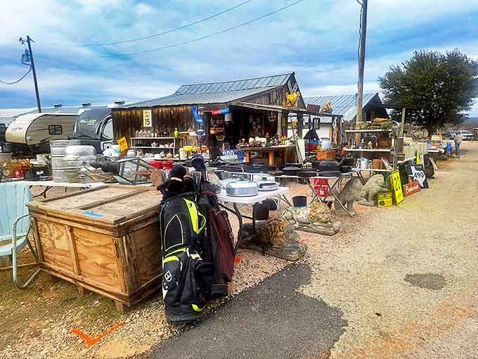 Outside this unassuming metal barn lies a treasure hunter's paradise where vintage wagons and garden art create the perfect Texas welcome committee.