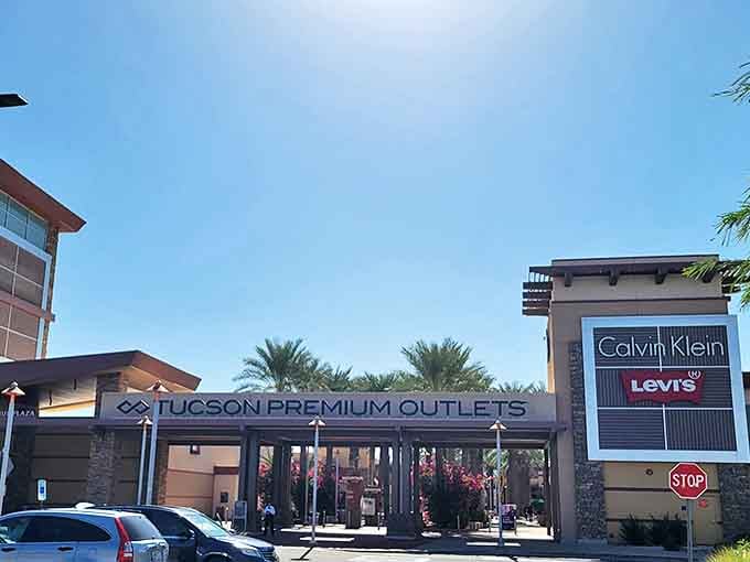 The grand entrance to Tucson Premium Outlets welcomes shoppers with desert-inspired architecture and the promise of designer deals under that perfect Arizona sky.