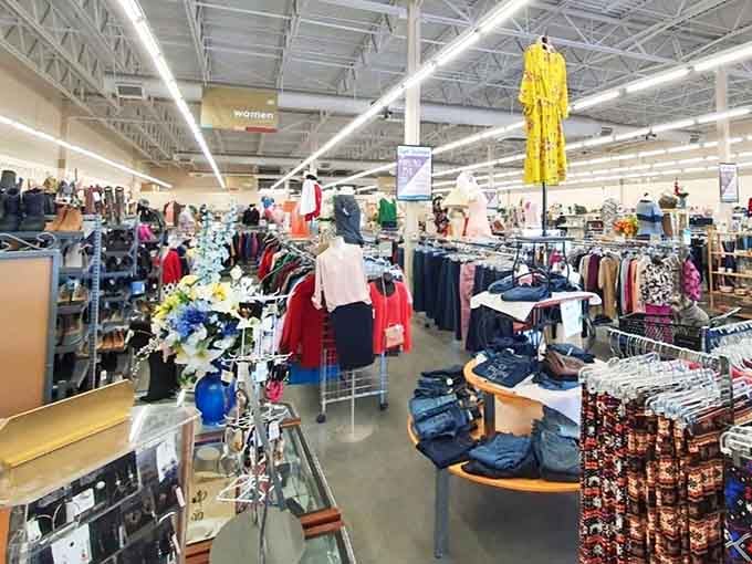 The grand expanse of possibility! Bright yellow dresses hang like beacons of hope amid a sea of fashion finds waiting to be discovered by savvy shoppers.