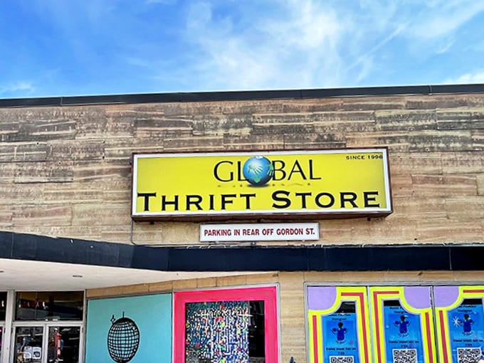 The bright yellow Global Thrift sign promises treasure hunting adventures beneath clear Massachusetts skies &ndash; like a Vegas billboard for bargain jackpots instead of slot machines.