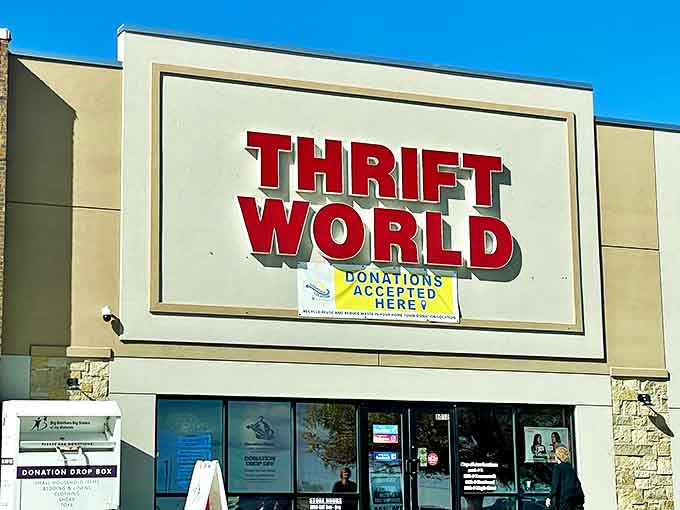 The iconic red Thrift World sign stands bold against Nebraska's blue sky, welcoming thrifters to this La Vista bargain paradise.