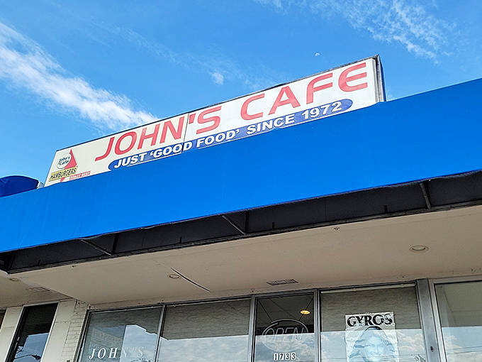 The blue awning of John's Cafe stands out like a beacon of hope for hungry travelers. "Just good food since 1973" isn't marketing&mdash;it's a promise kept.