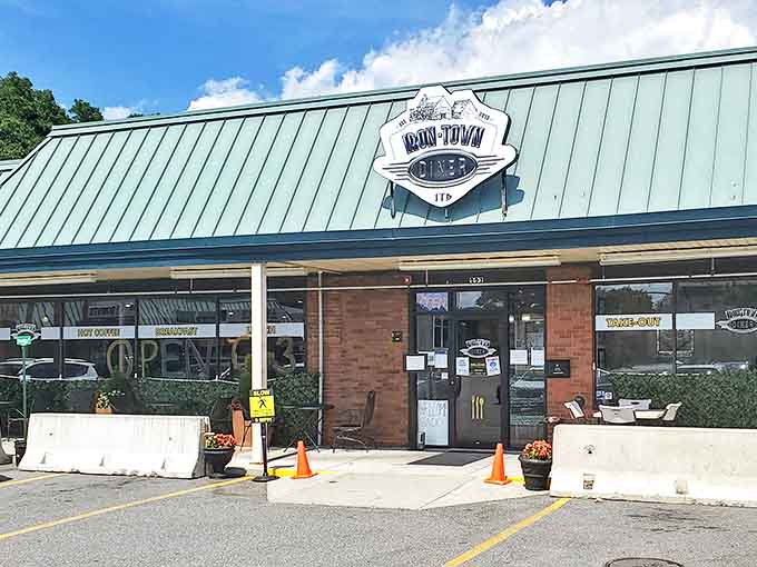 The unassuming exterior of Iron Town Diner in Saugus – where breakfast dreams come true beneath that classic diner signage.