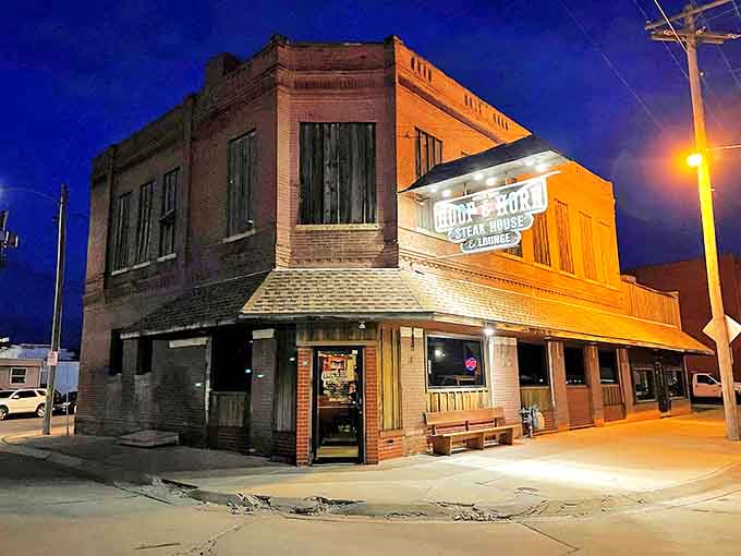 The Hoof & Horn glows like a beacon of culinary promise against the twilight sky, a brick-and-mortar love letter to carnivores everywhere.