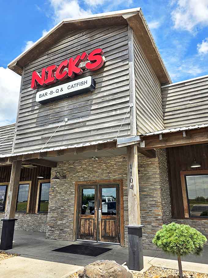 The rustic wooden exterior of Nick's practically screams "good food inside!" with its bold red signage and stone accents&mdash;Arkansas roadside architecture at its most honest.