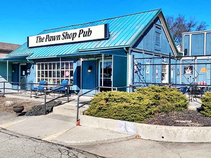 Bathed in sunshine, the Pawn Shop Pub's blue exterior welcomes hungry visitors seeking authentic comfort food in Indianapolis' Keystone-Monon neighborhood.