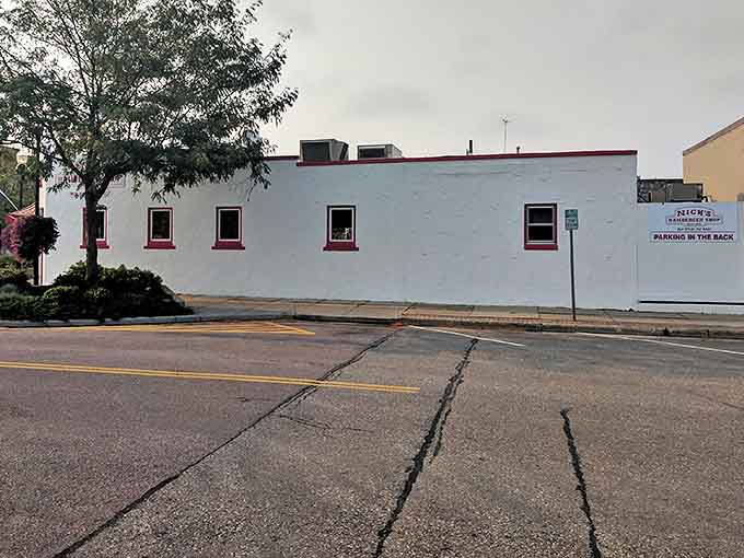 The iconic white building with red trim stands like a time capsule on Brookings' Main Avenue, beckoning burger lovers since 1929.