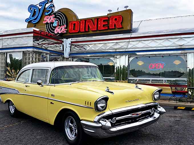 A sunshine-yellow Chevy perfectly complements DJ's neon signage, creating a time-travel tableau that promises pancakes and nostalgia inside.