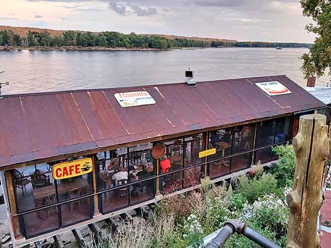 Perched right on the Mississippi like a weathered postcard come to life, the Fish Shack's rustic metal roof and screened-in dining area promise river views with every bite.